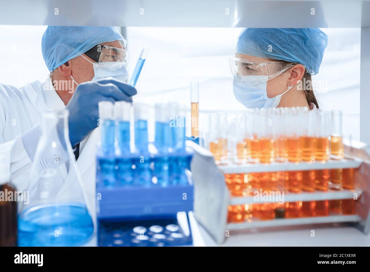 Man glasses pipette biochemistry mask hi-res stock photography and ...