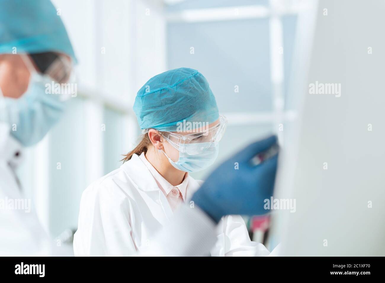 Man glasses pipette biochemistry mask hi-res stock photography and ...