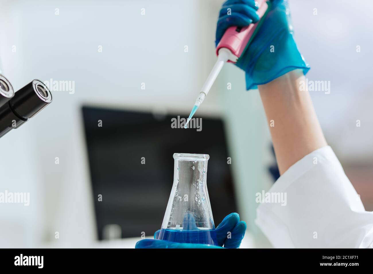 Man glasses pipette biochemistry mask hi-res stock photography and ...