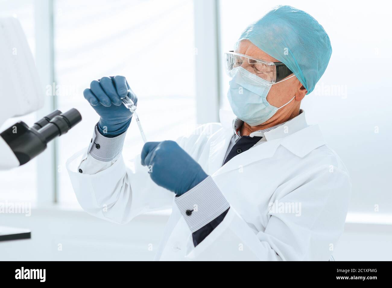 Scientist works in laboratory developing hi-res stock photography and ...