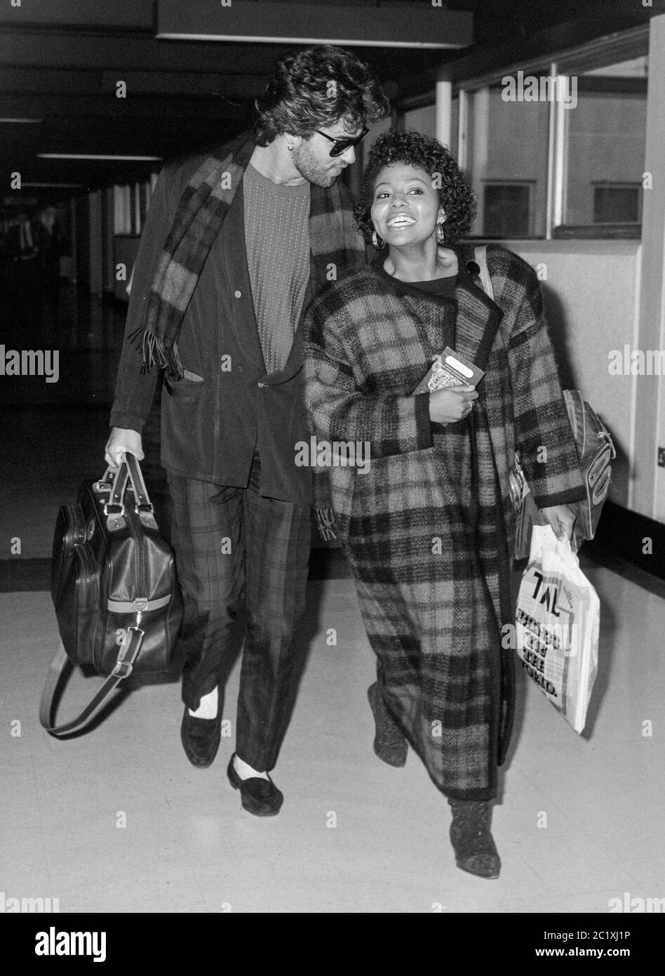 Singer George Michael and girlfriend model Pat Fernandez leaving London ...