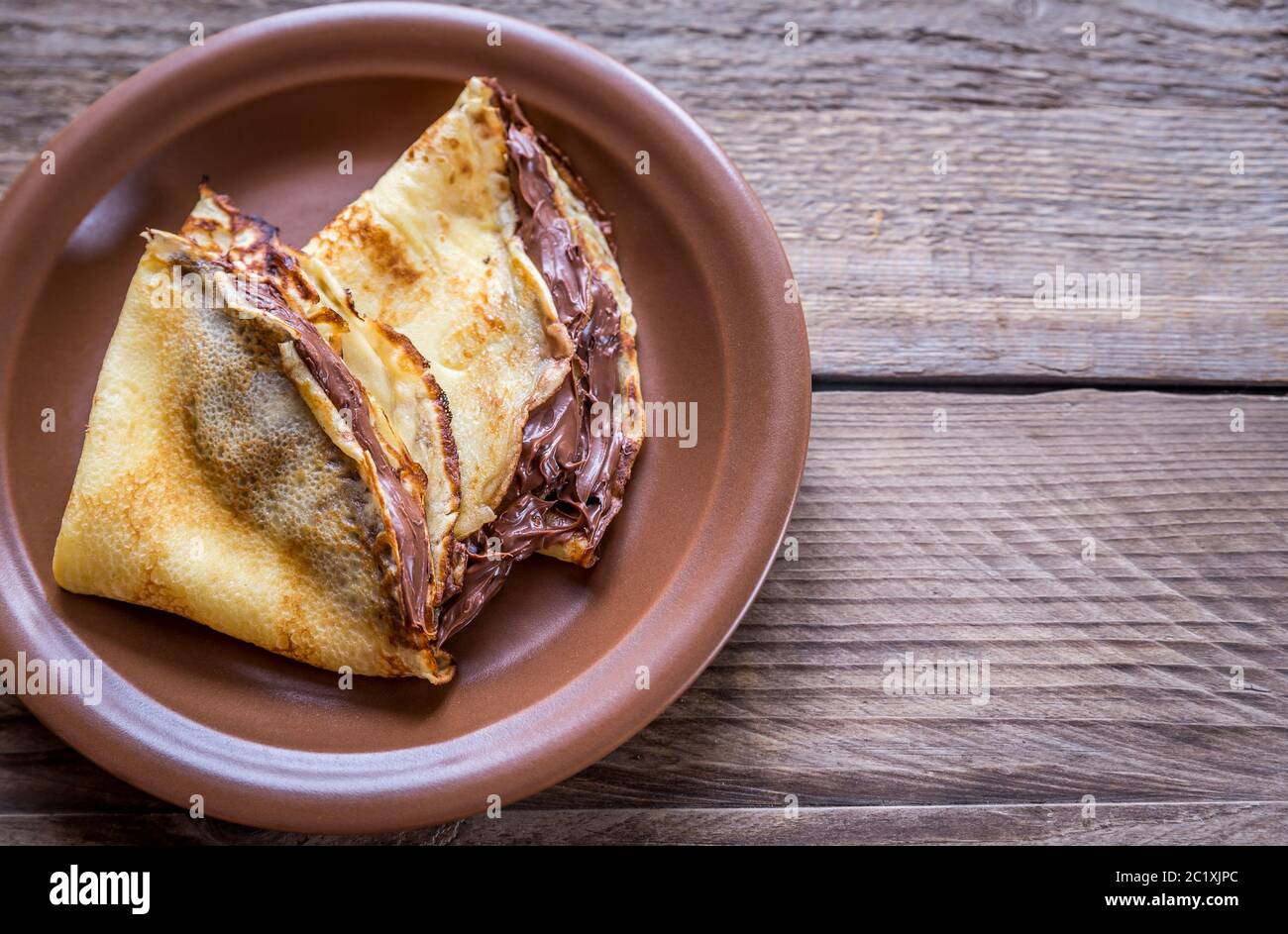 Crepes dark chocolate sauce hi-res stock photography and images - Alamy