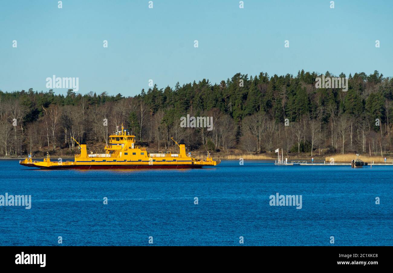 Yellow ferry for transporting cars and people from the islands of the ...