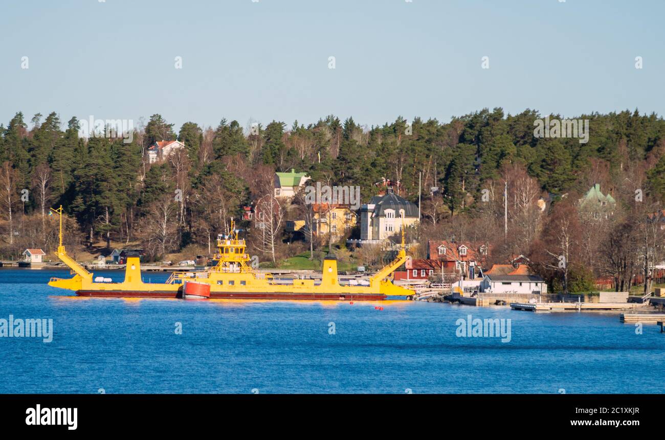 Yellow ferry for transporting cars and people from the islands of the ...