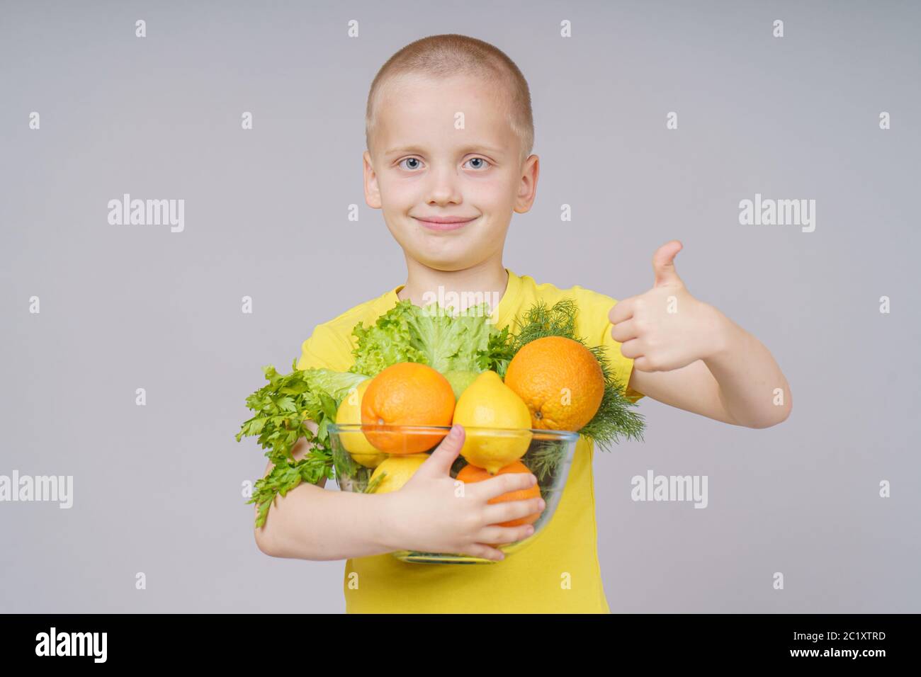 Cute children with healthy food. Isolated on gray background Stock ...