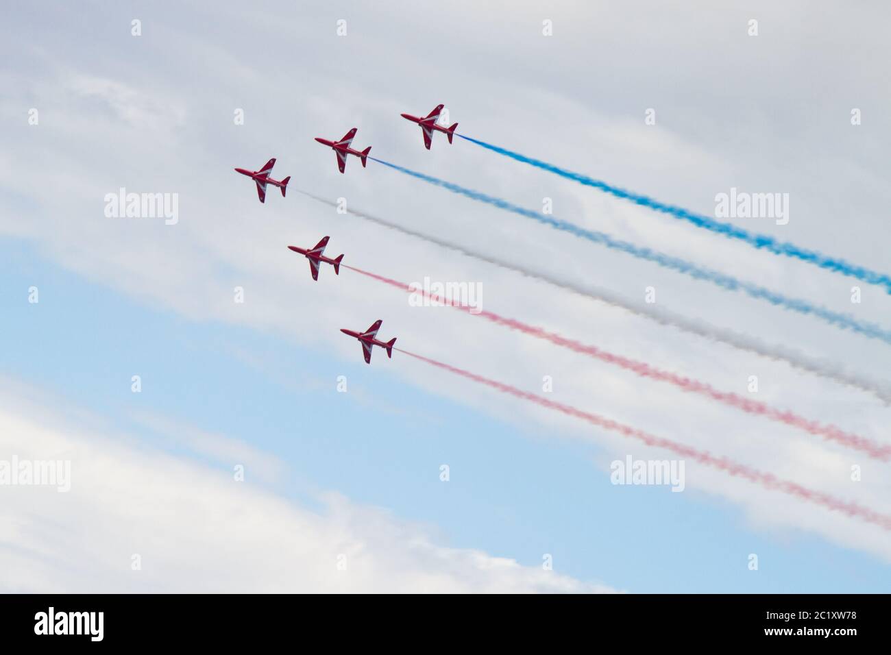 An RAF Red Arrow Display in England Stock Photo - Alamy
