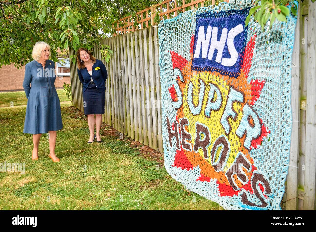 The Duchess of Cornwall is shown a knitted tribute to NHS staff by ...