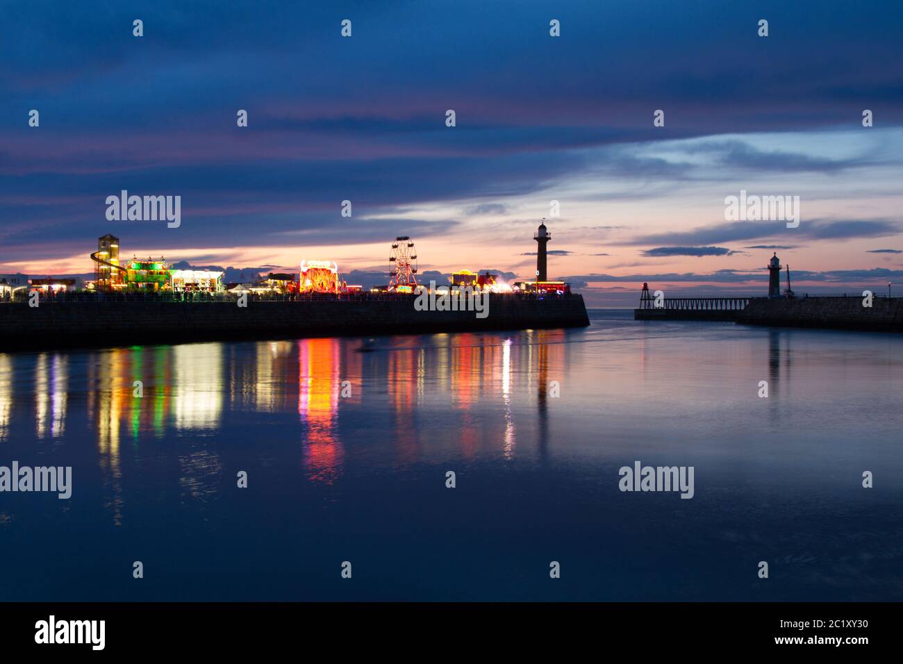 Whitby Annual regatta Fairground on the Pier at Night Stock Photo - Alamy