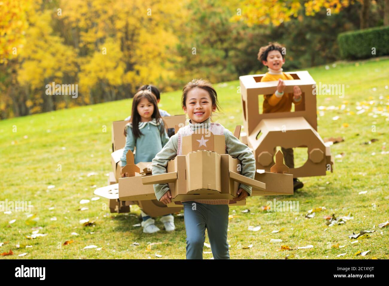 Happy children's play to fly Stock Photo - Alamy