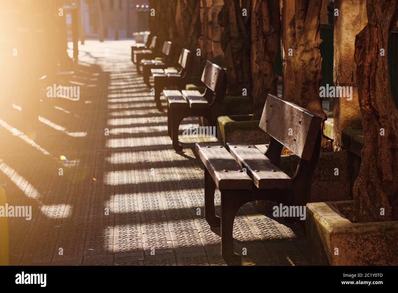 wooden bench in the street Stock Photo - Alamy
