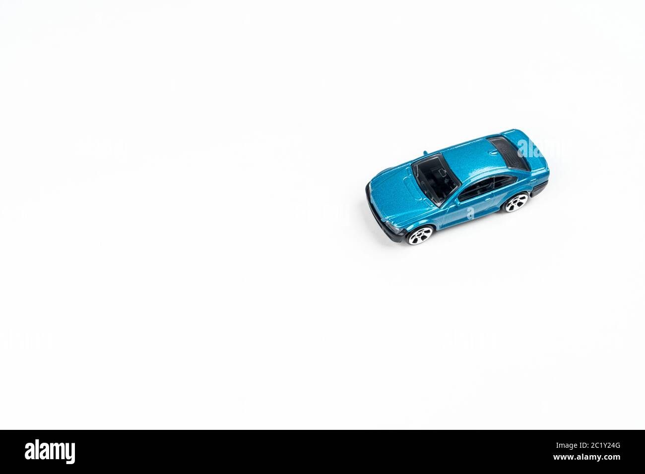 Blue toy car on a white isolated background Stock Photo - Alamy