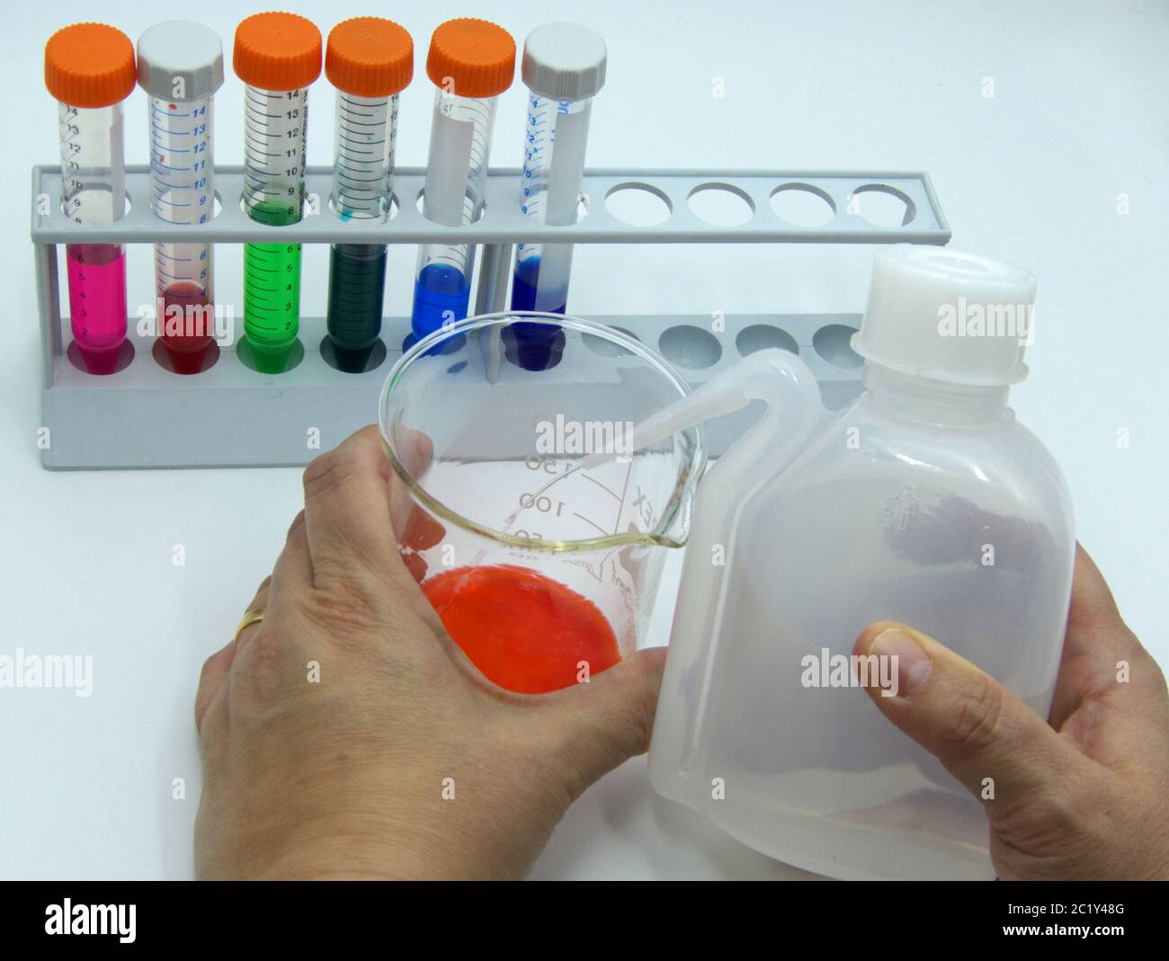 Laboratory technician conducts experiments on white background Stock ...