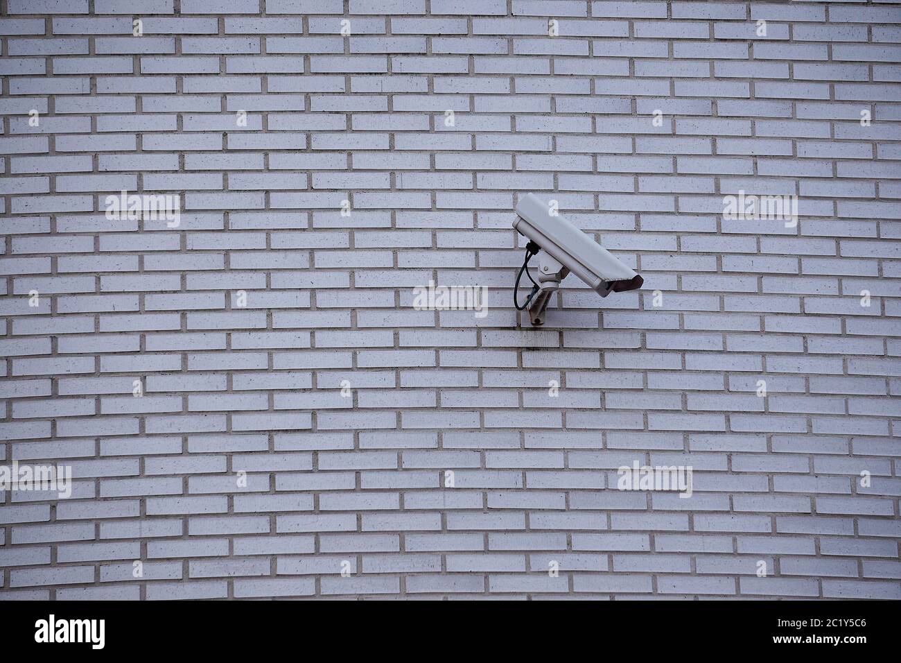 security camera on the wall Stock Photo - Alamy