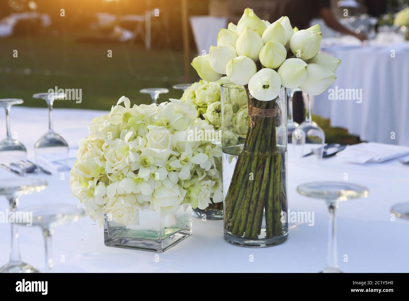 Dinning wedding table set with white lotus Stock Photo - Alamy