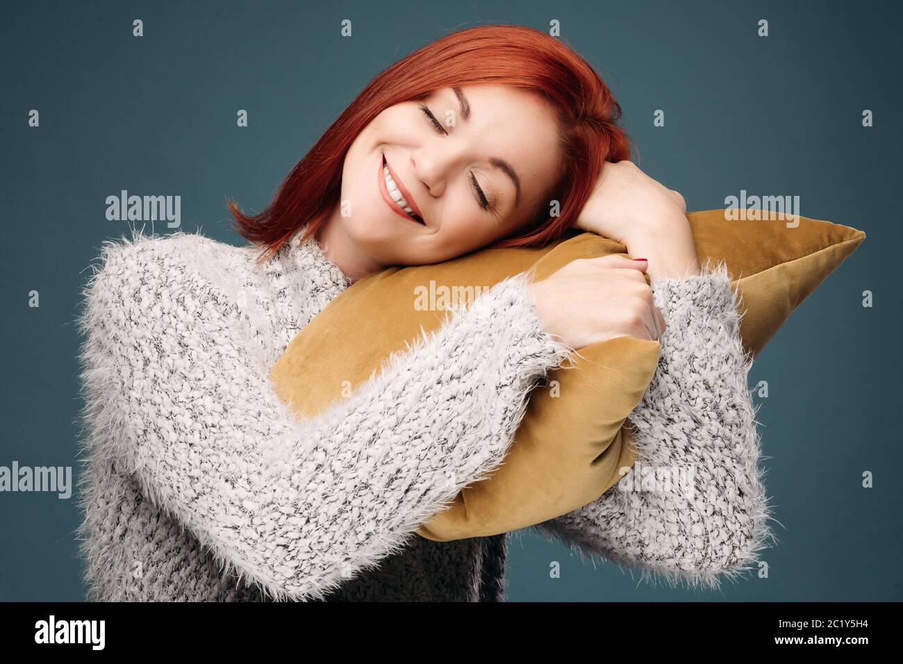 Beautiful woman hugging pillow hi-res stock photography and images - Alamy