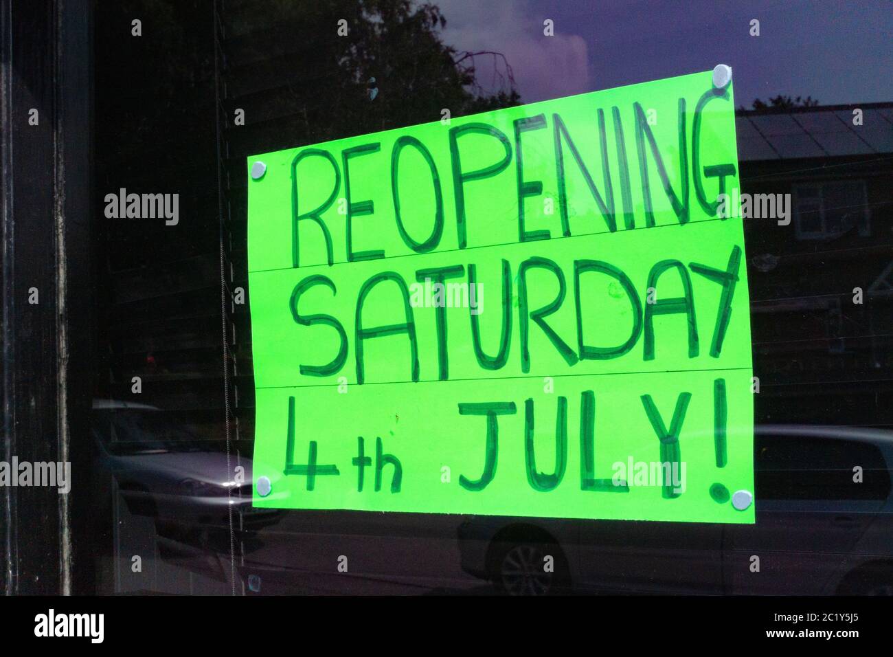 reopening shop sign Stock Photo - Alamy