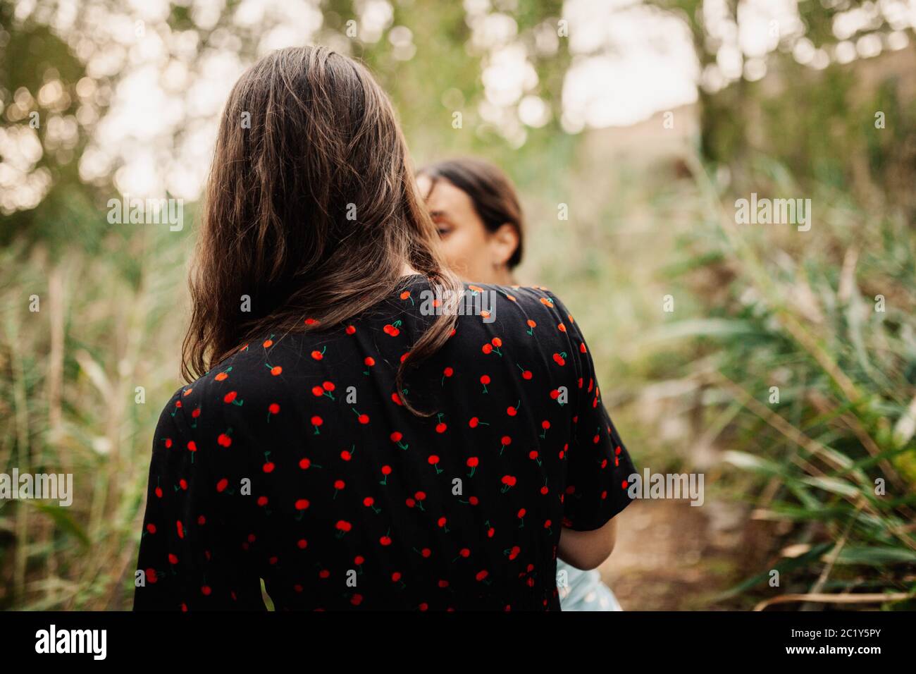 Back view two women outside walking hi-res stock photography and images ...