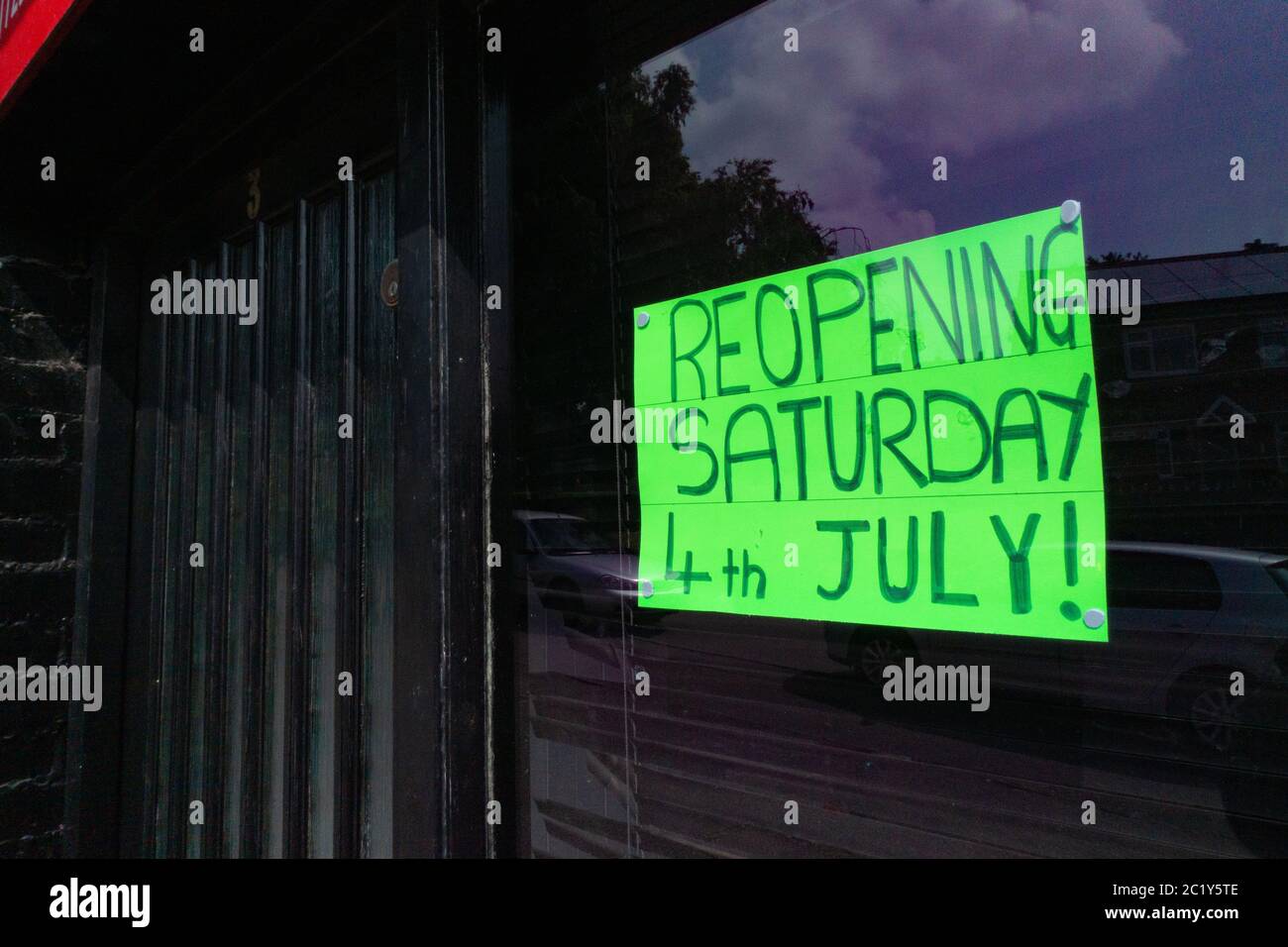 reopening shop sign Stock Photo - Alamy