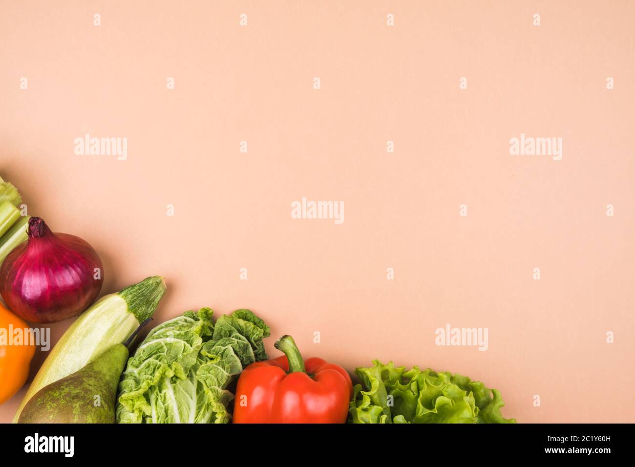 Vegetables and fruits on a beige background. Healthy eating and ...