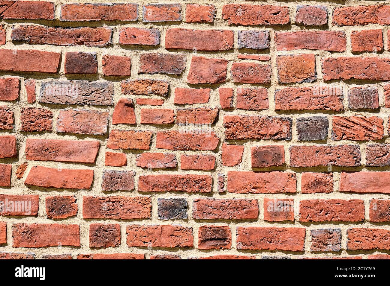 Background from an irregular red brick wall Stock Photo - Alamy