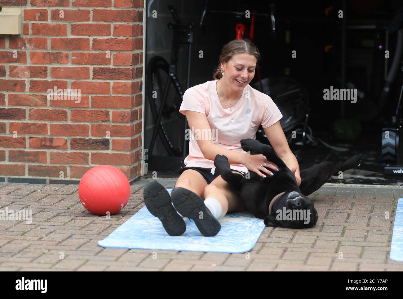 Triathlete Olivia Mathias and her dog Dillion during a training session ...