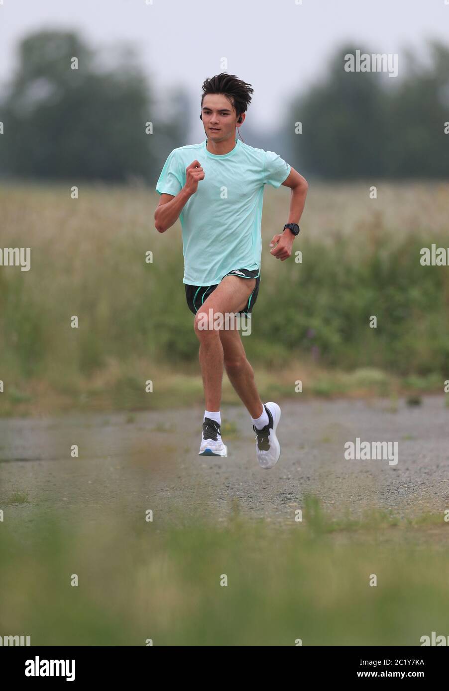 Triathlete Alex Yee during a training session on a disused airfield in ...