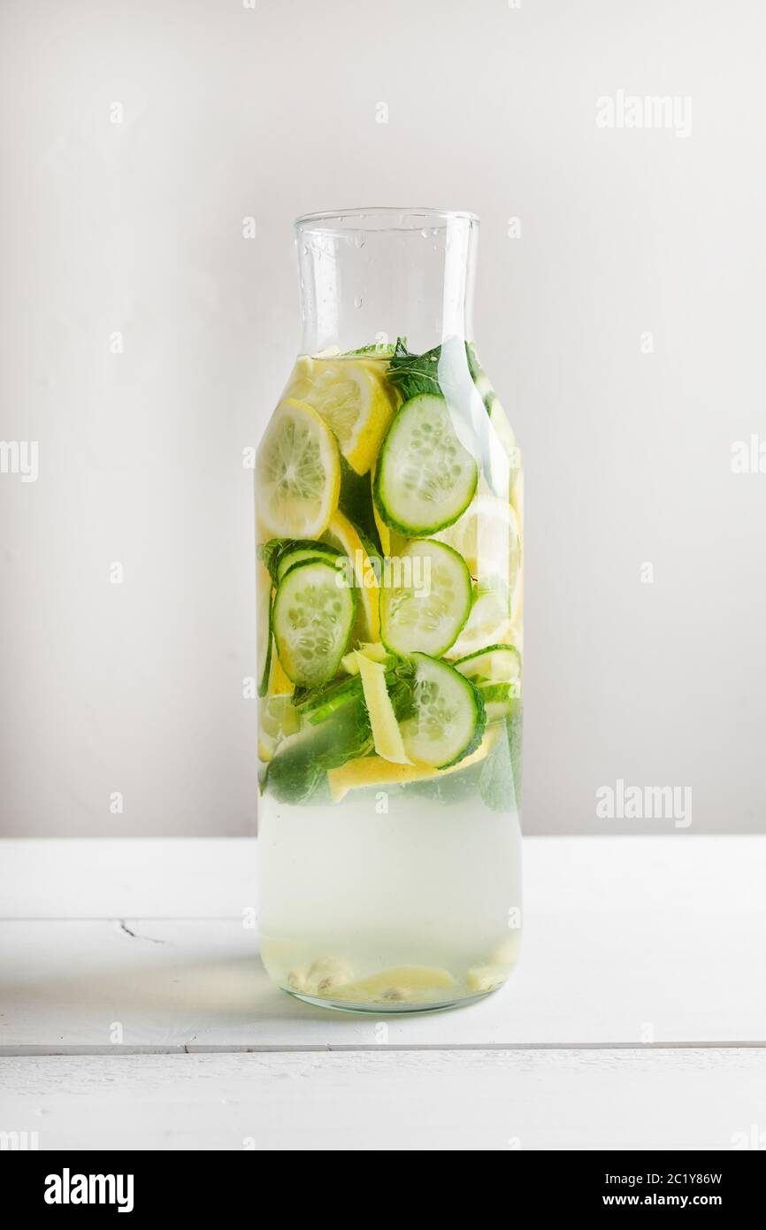 Sassy diet water. Cucumber, lemon, mint lemonade in glasses on white ...