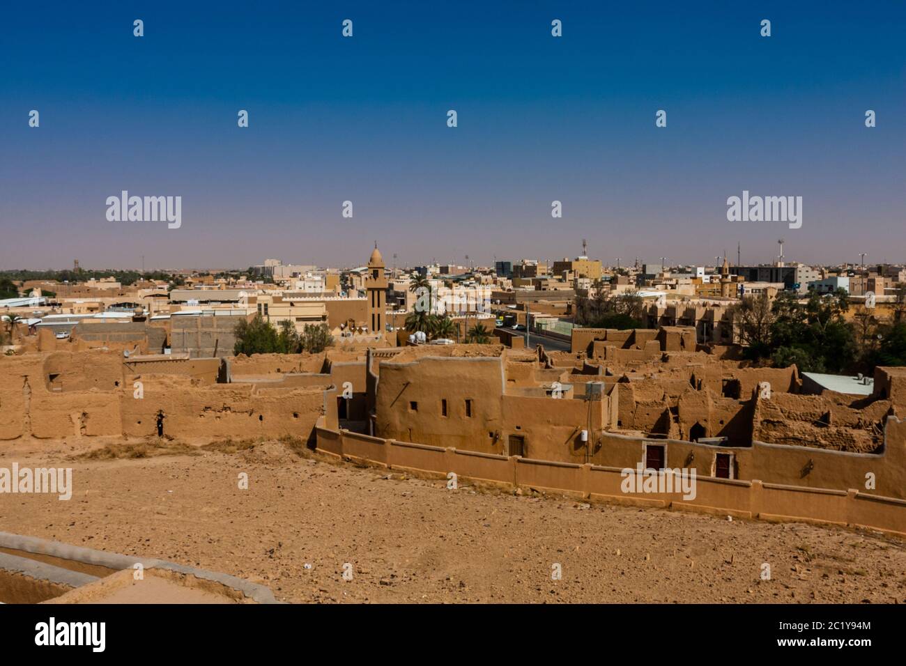The ruined and partially restored traditional mud brick houses in Al ...