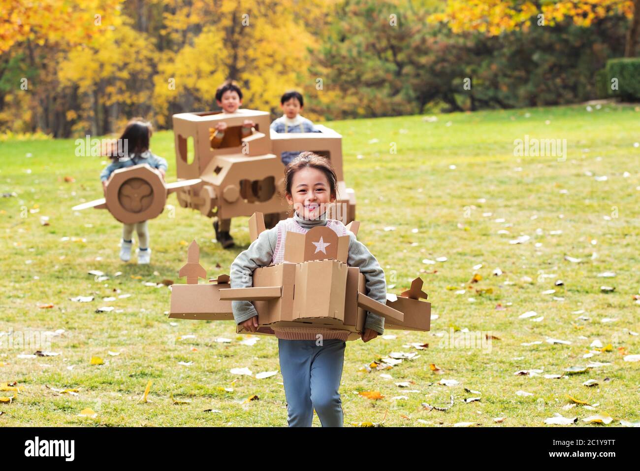 Happy children's play to fly Stock Photo - Alamy