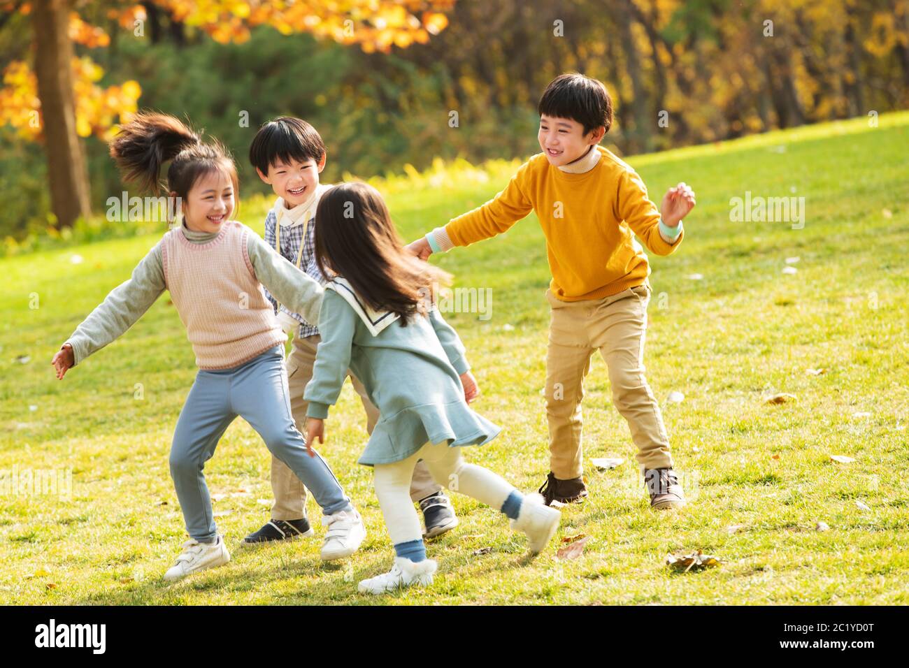 Happy children playing in the park Stock Photo - Alamy