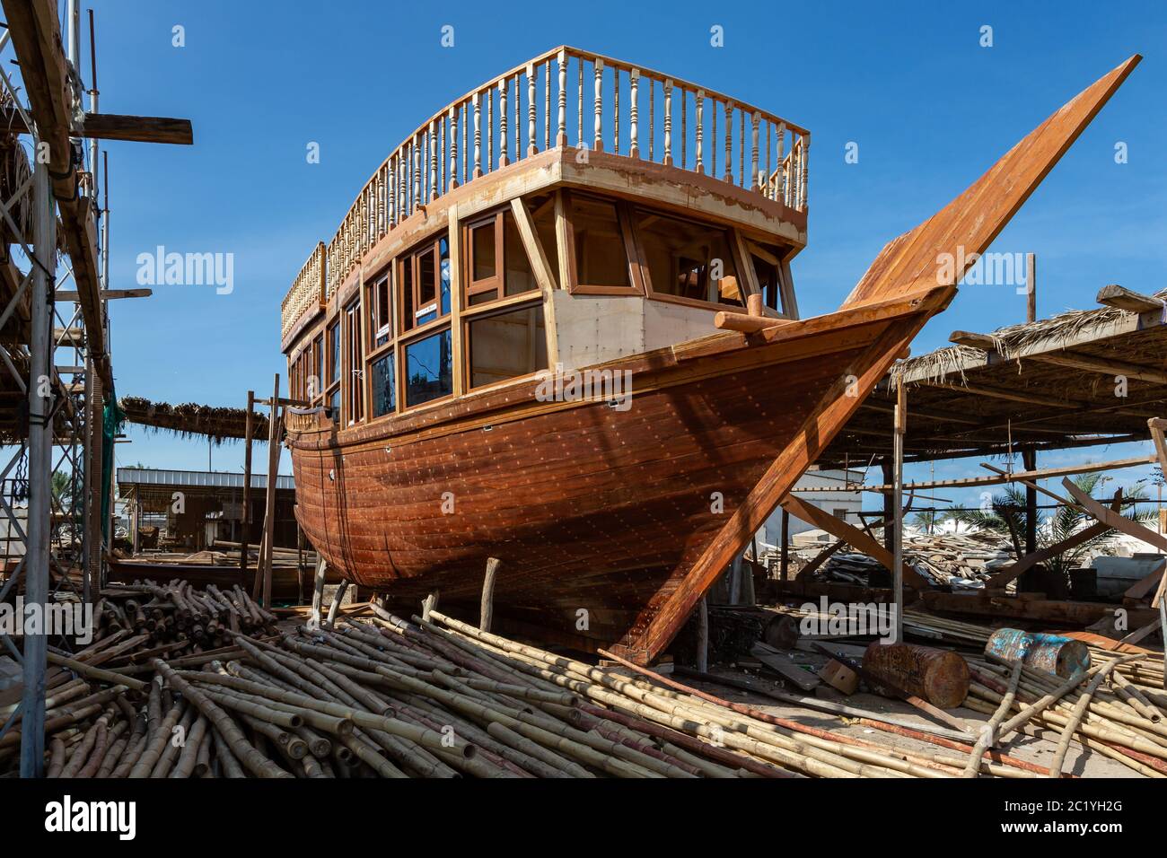 Traditional dhow under construction in wharf in Sur, Oman Stock Photo ...
