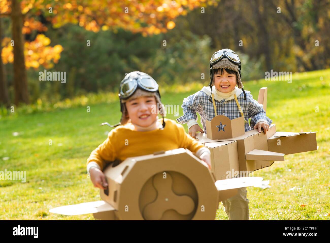 Two boys play to fly Stock Photo - Alamy