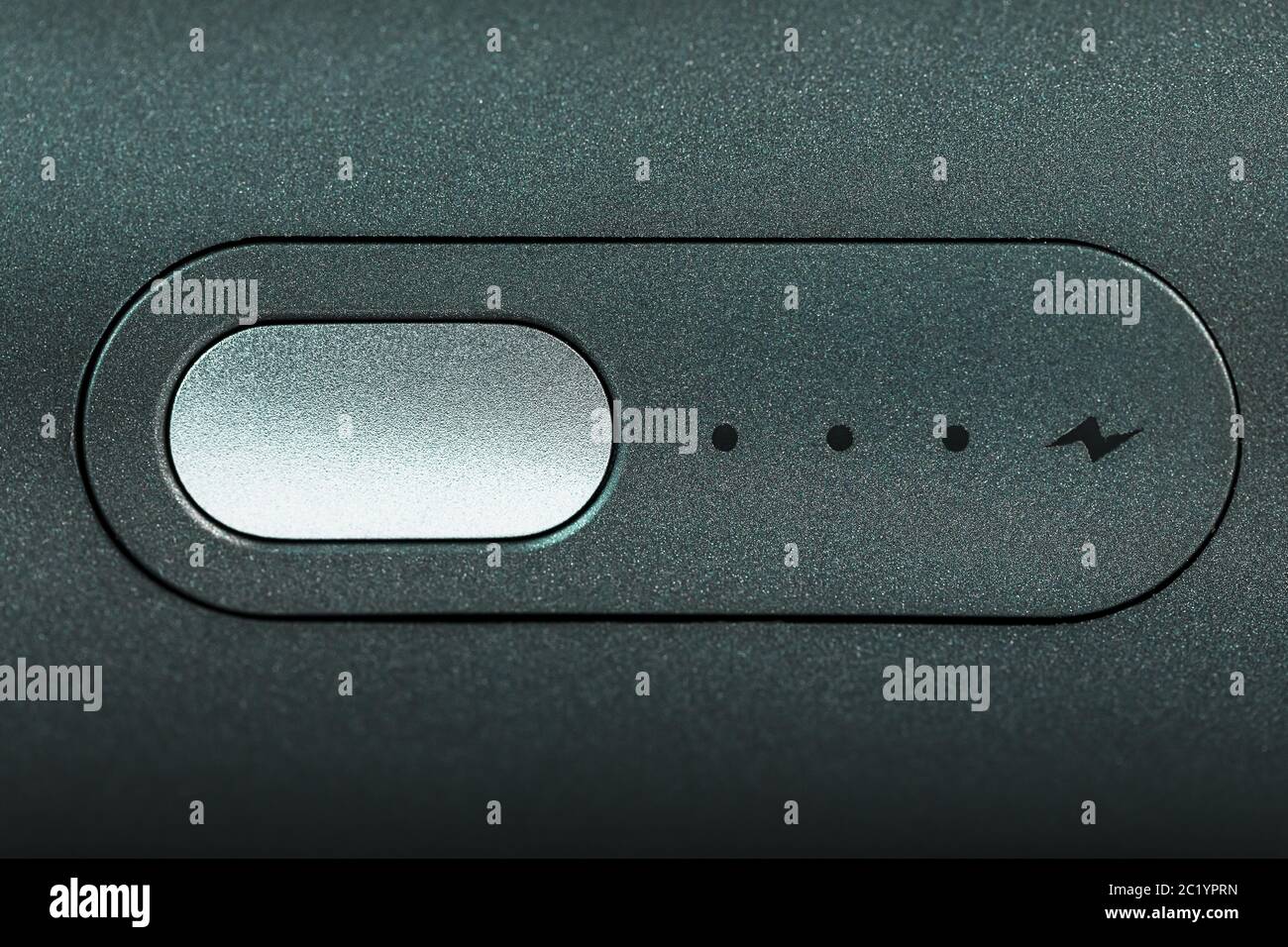 Button with led charging indication close up on the grey device Stock ...