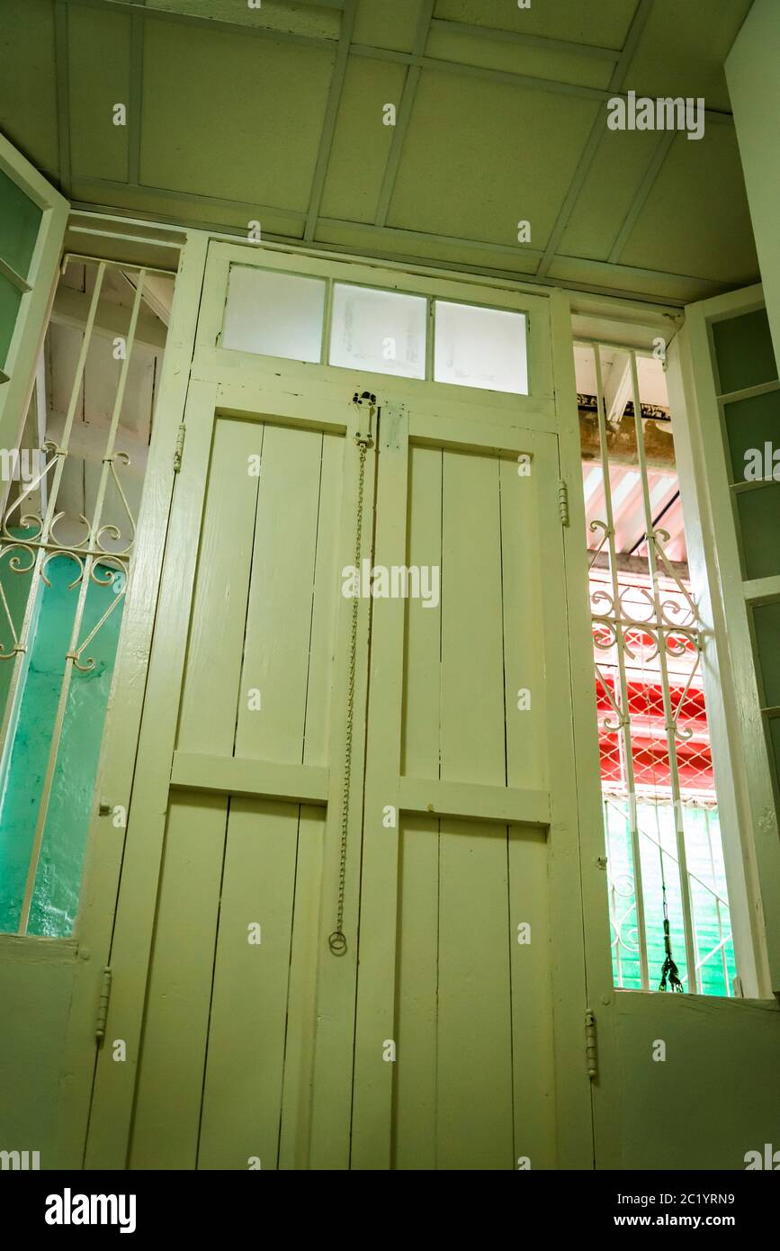 Tall door of a room with high ceiling in an old house, Santa Clara ...
