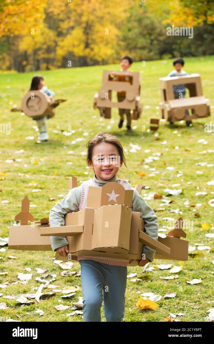 Happy children's play to fly Stock Photo - Alamy