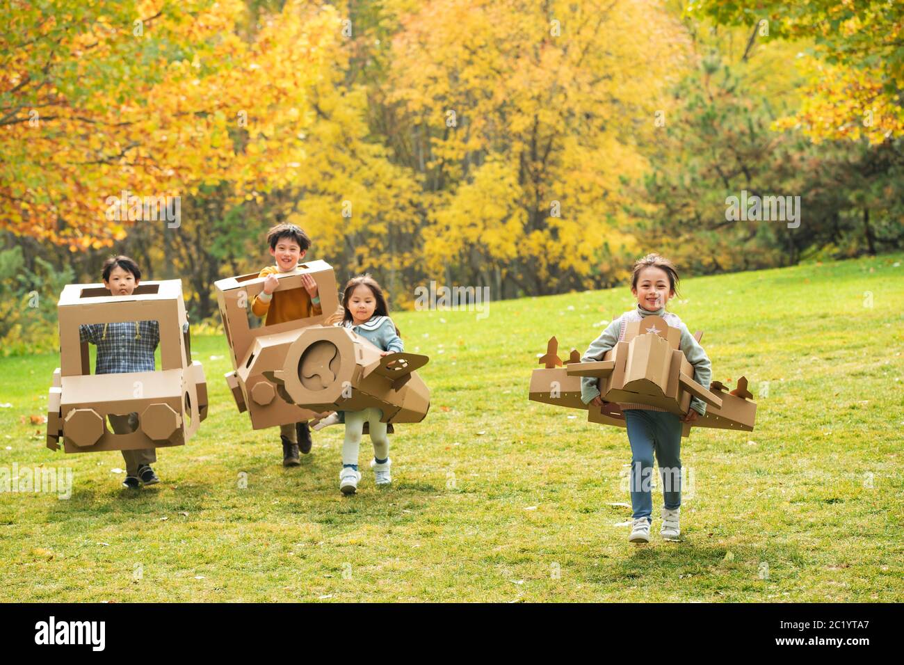 Happy children's play to fly Stock Photo - Alamy