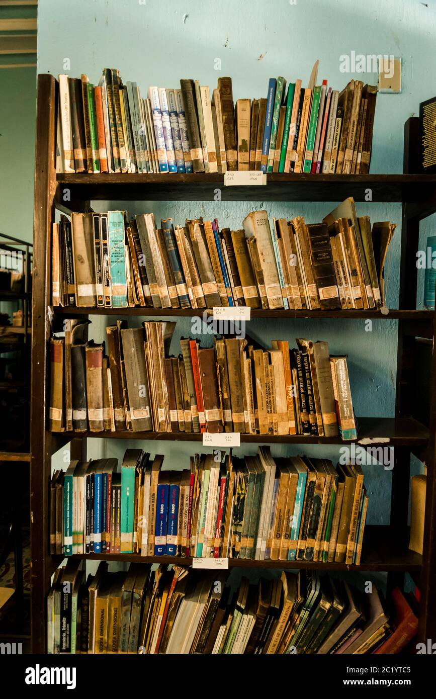 Bookshelf with old, worn books, Marti Library which is housed in the ...