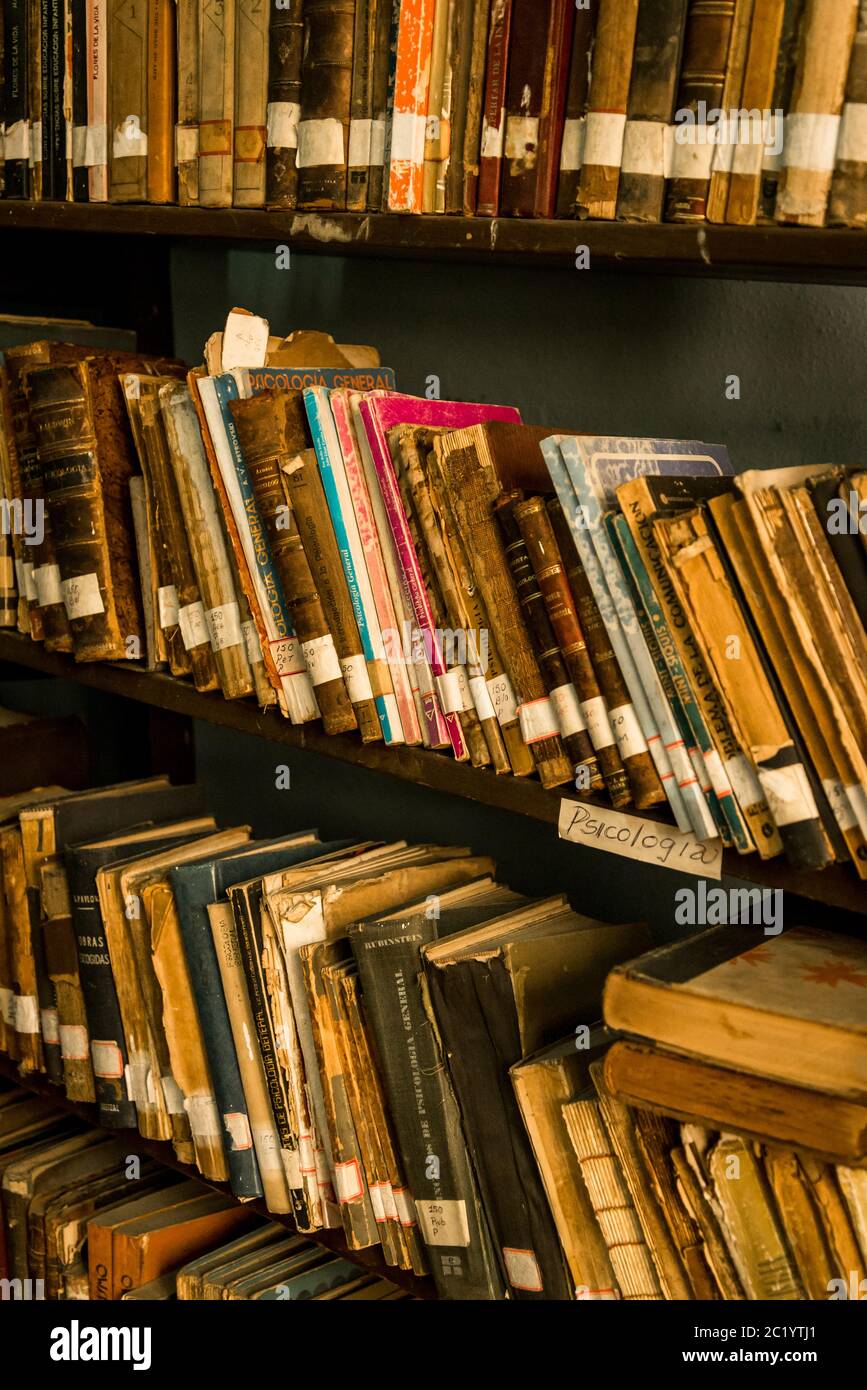 Bookshelf with old, worn books, Marti Library which is housed in the ...