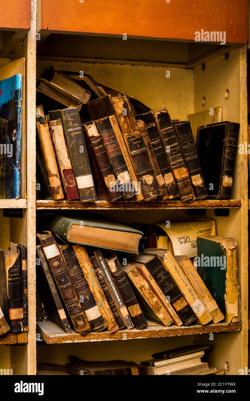 Bookshelf with old, worn books, Marti Library which is housed in the ...