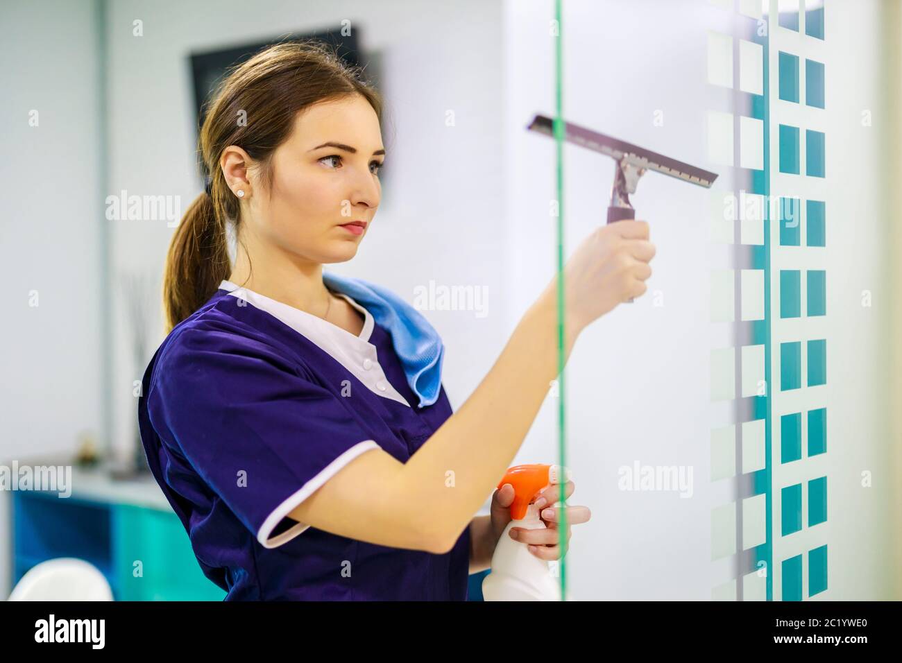 Attractive Woman Washing the Window with spray and rag Stock Photo - Alamy