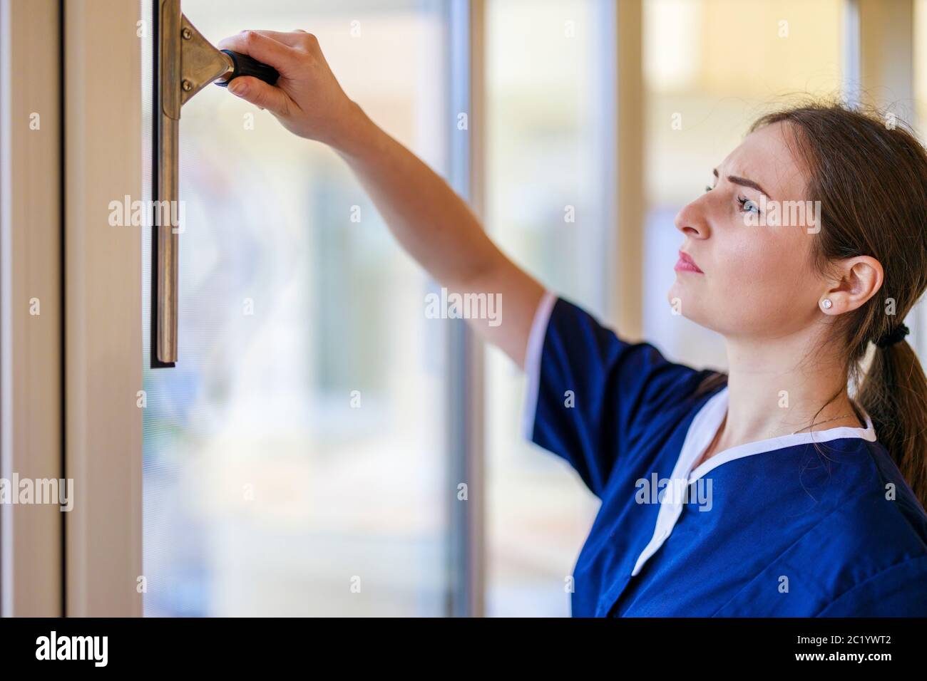 Attractive woman washing window hi-res stock photography and images - Alamy