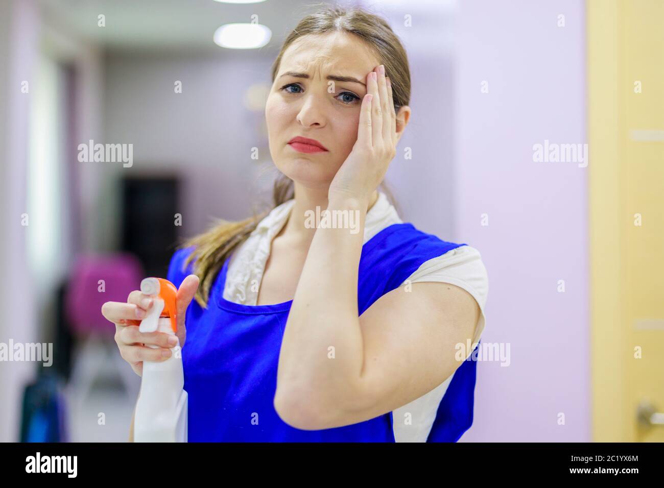 Cleaning woman tired and exhausted from cleaning the house Stock Photo ...