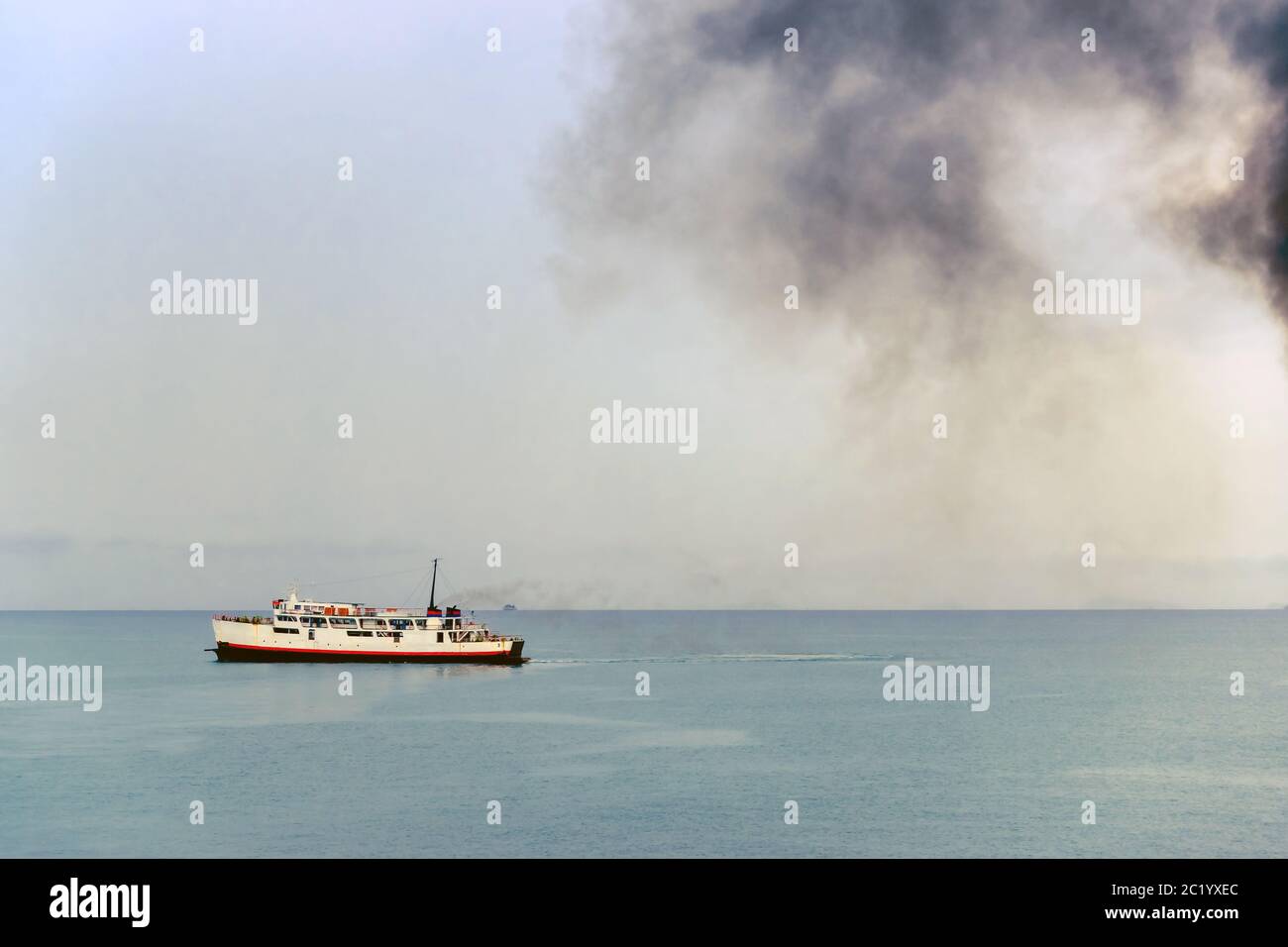 Exhaust pipe of ferry boat with black thick smoke coming out and sky ...