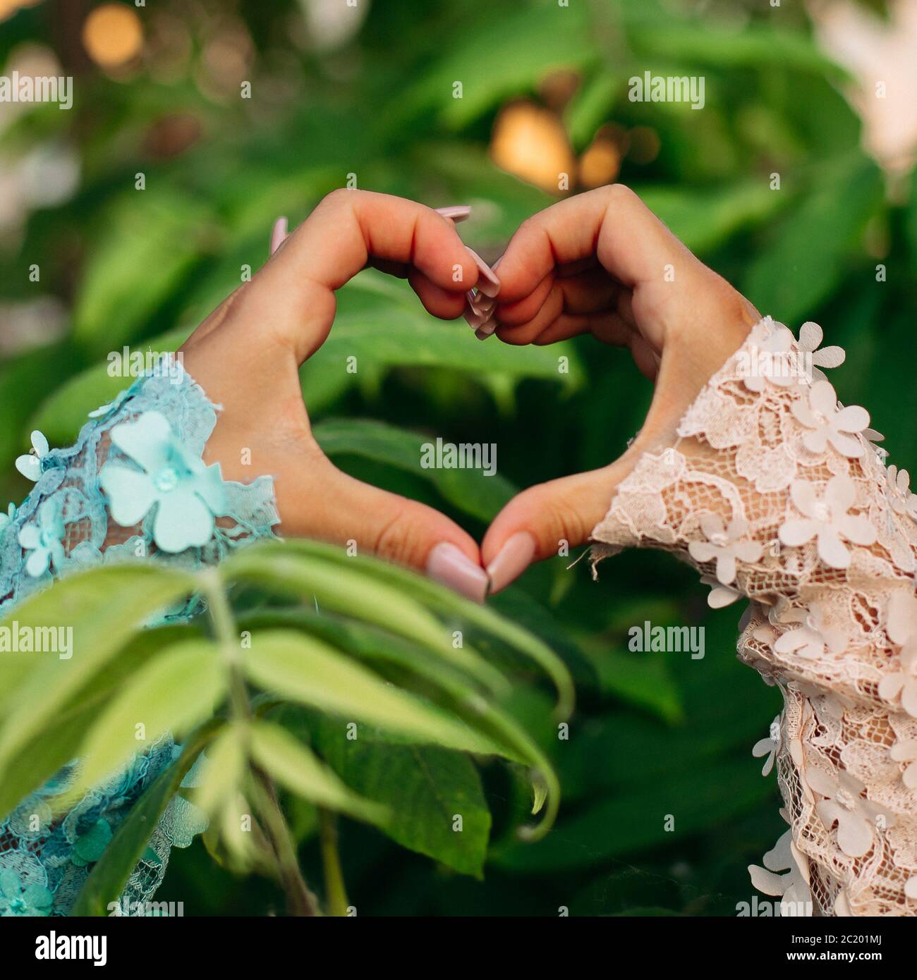 Women heart hands hi-res stock photography and images - Alamy