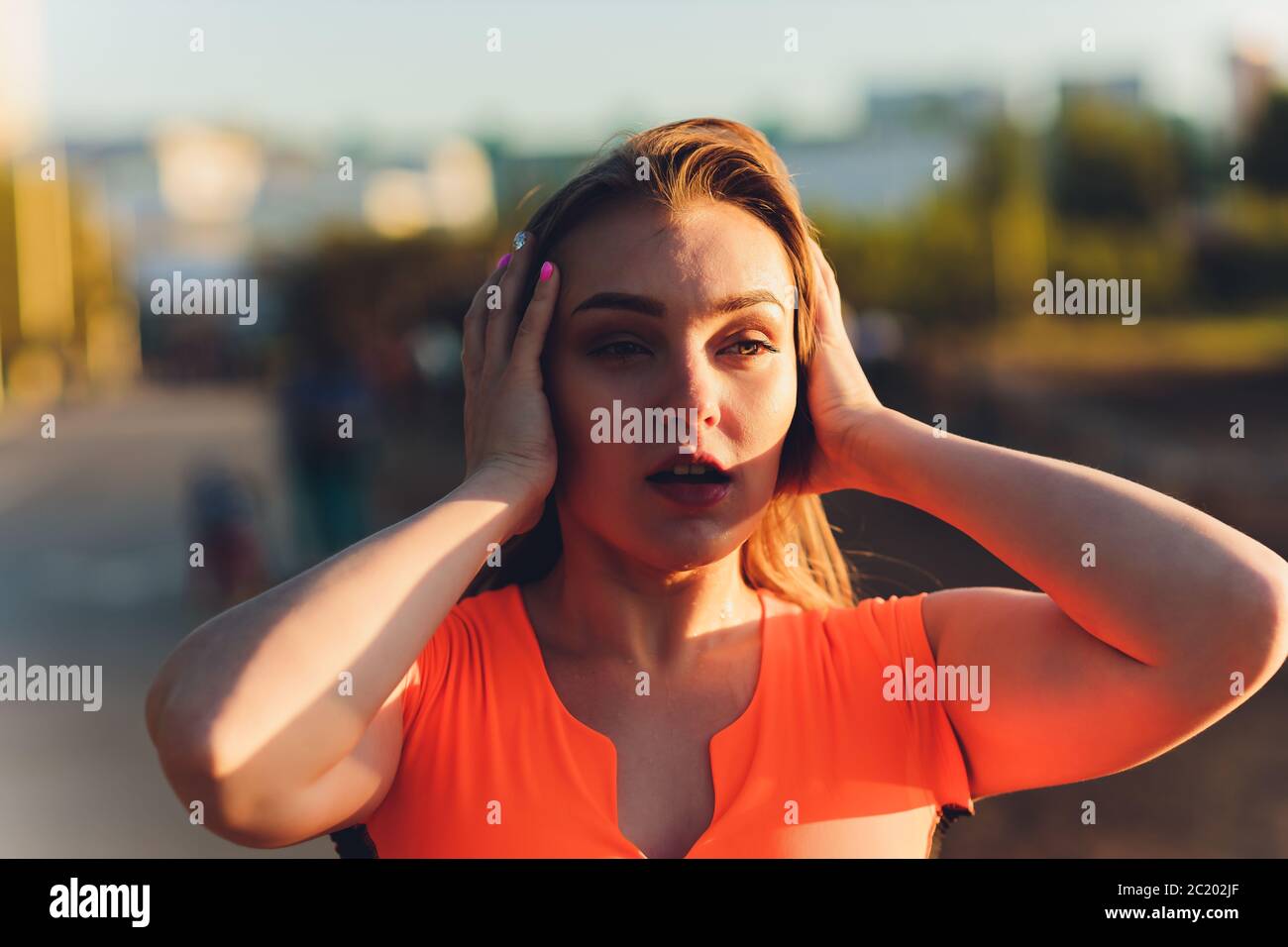 Tired runner sweating after running hard in countryside road. Exhausted ...