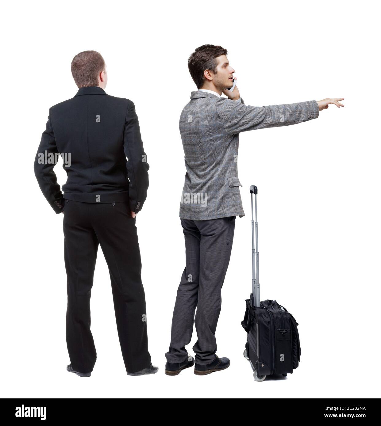 Back view of two business men in suit pointing. Business team ...