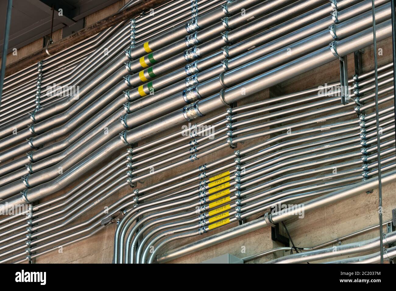 Rows of new Conduit installed in a renovated building Stock Photo - Alamy