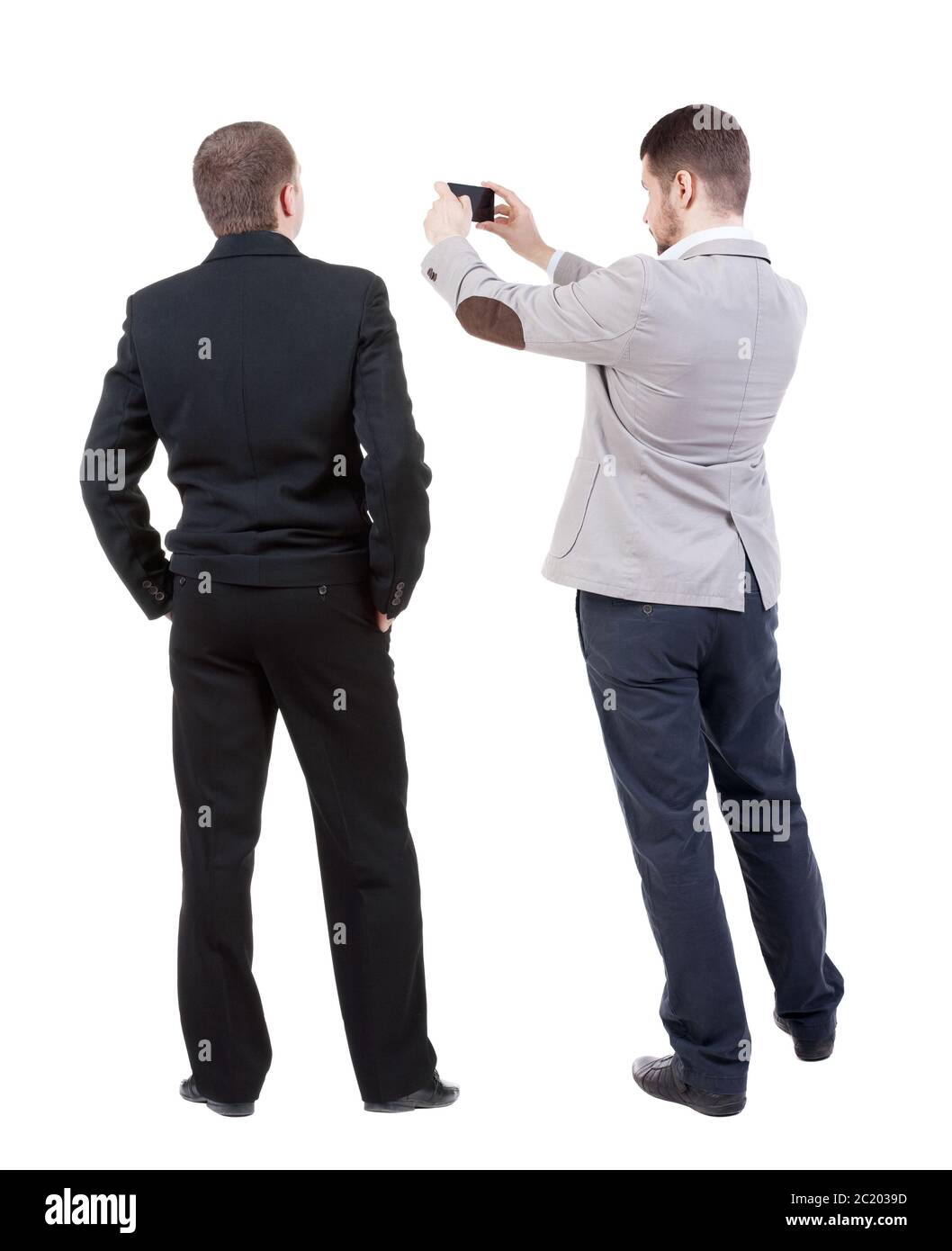 Back view of two business man in suit with mobile phone. Business team ...
