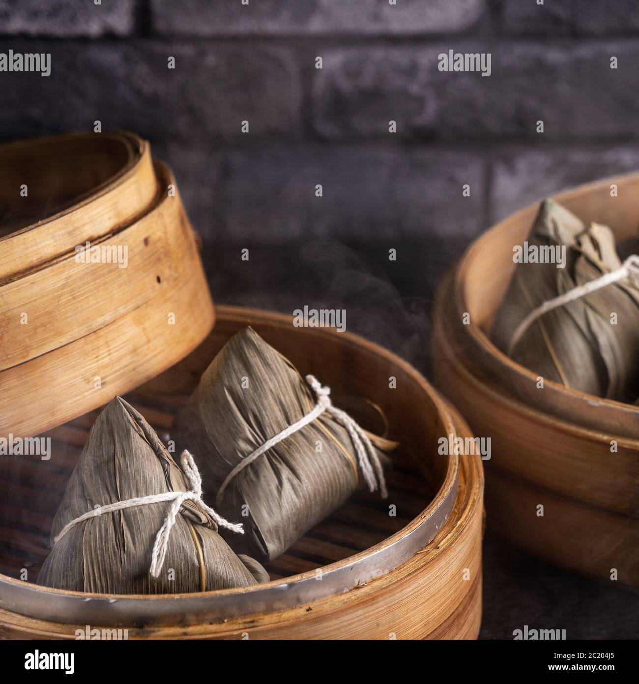 Rice dumpling, zongzi - Chinese rice dumpling zongzi on black brick ...