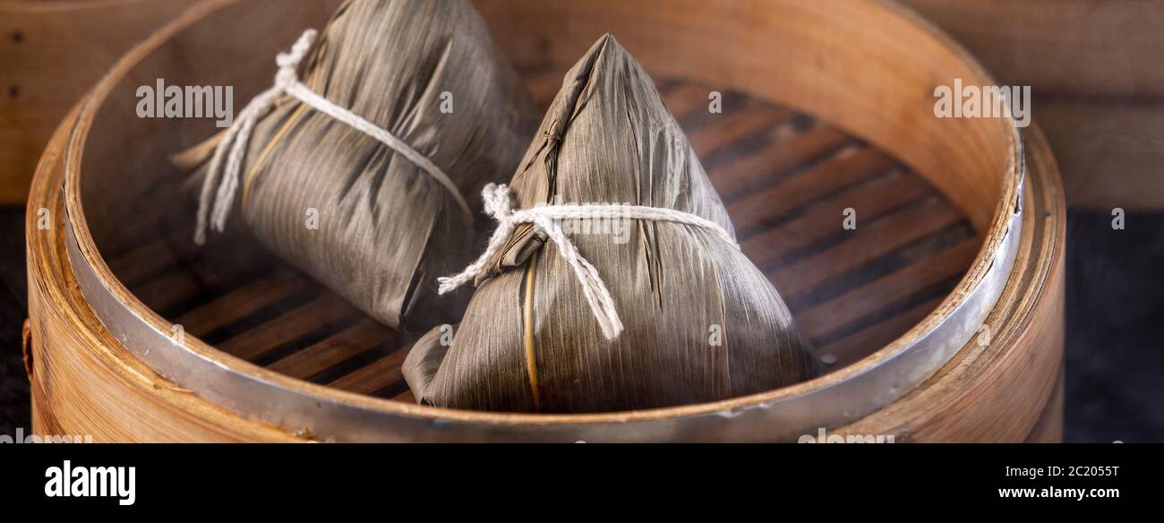 Rice dumpling, zongzi - Chinese rice dumpling zongzi on black brick ...